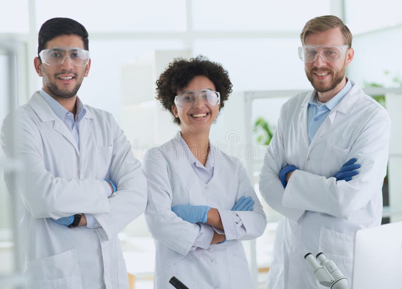 Smiling Scientists Looking at Camera Arms Crossed in Laboratory Stock ...