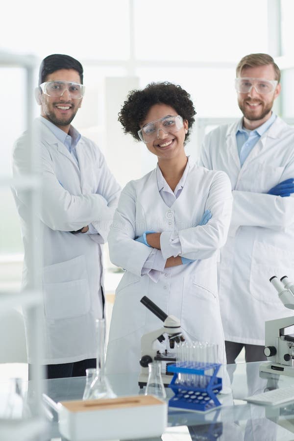 Smiling Scientists Looking at Camera Arms Crossed in Laboratory Stock ...