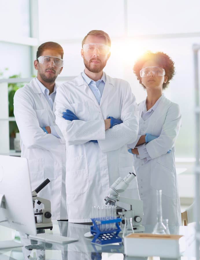 Smiling Scientists Looking at Camera Arms Crossed in Laboratory Stock ...