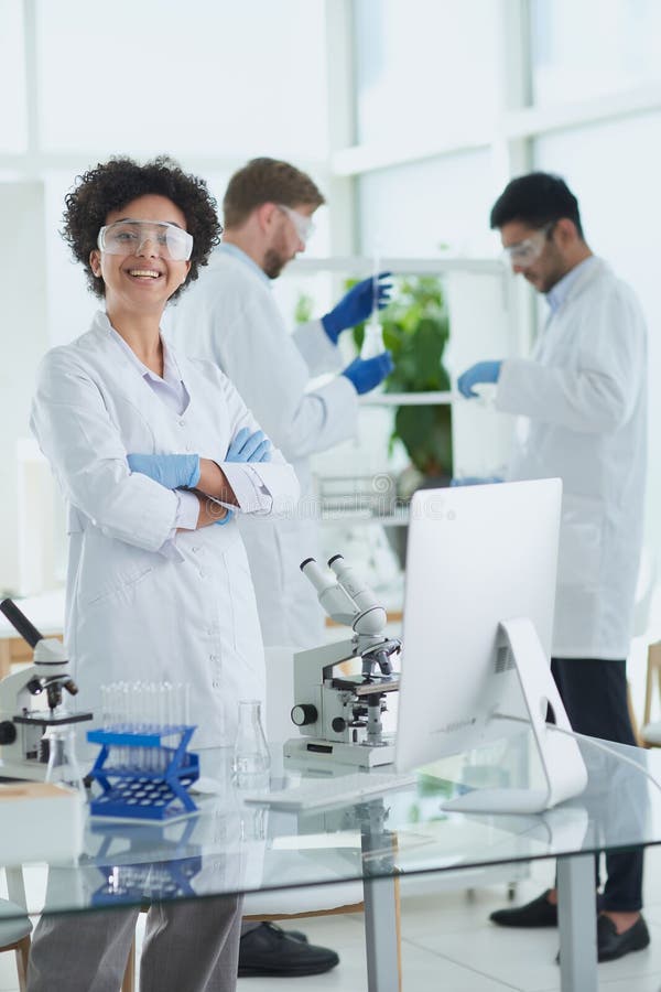 Smiling Scientists Looking at Camera Arms Crossed in Laboratory Stock ...