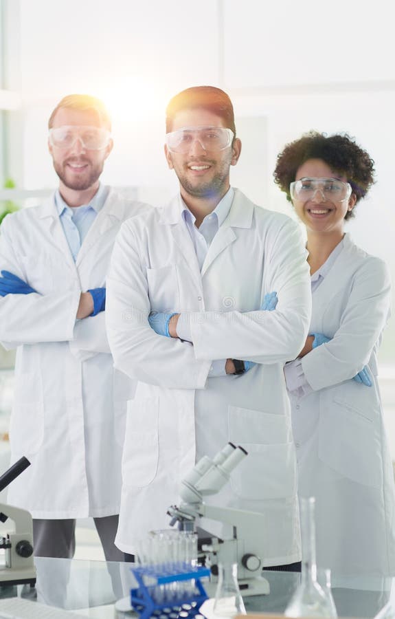 Smiling Scientists Looking at Camera Arms Crossed in Laboratory Stock ...