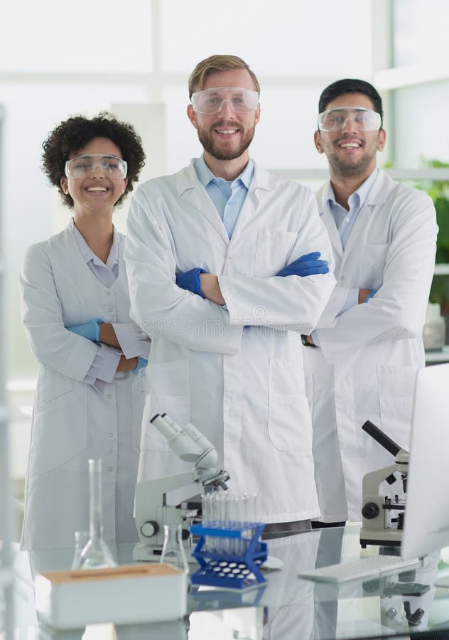 Smiling Scientists Looking at Camera Arms Crossed in Laboratory Stock ...
