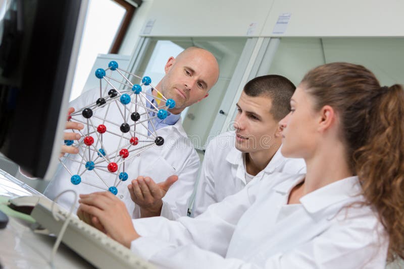 Smiling Scientists Working with Dna Model in Laboratory Stock Image ...