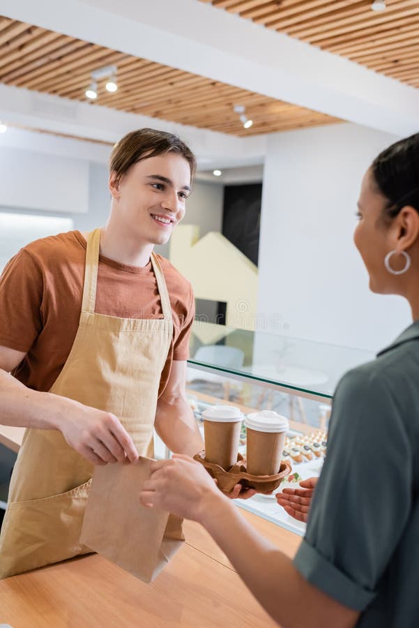 Smiling Seller Giving Coffee To Go Stock Image - Image of lunch ... Smiling Seller Giving Coffee To Go Stock Image - Image of lunch ...