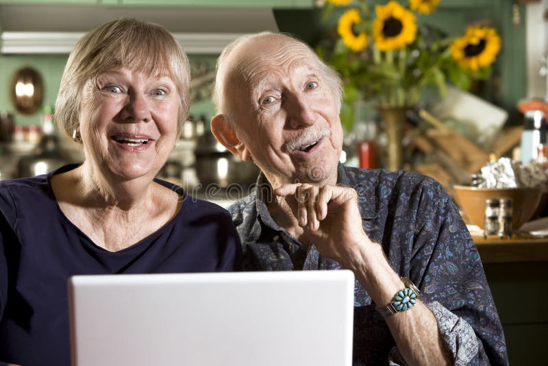 Smiling Senior Couple with a Laptop Computer Stock Image - Image of ...