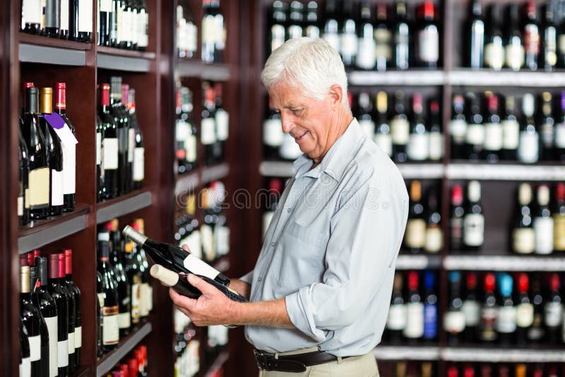 Smiling Senior Man Choosing Wine Stock Image - Image of active, licence ...