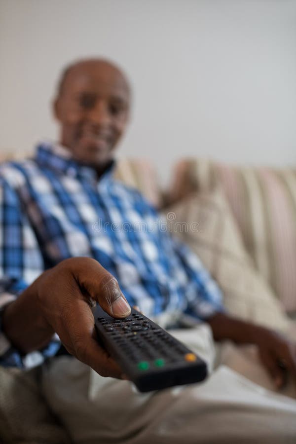 Smiling Senior Man Holding Remote Control Stock Image - Image of ...