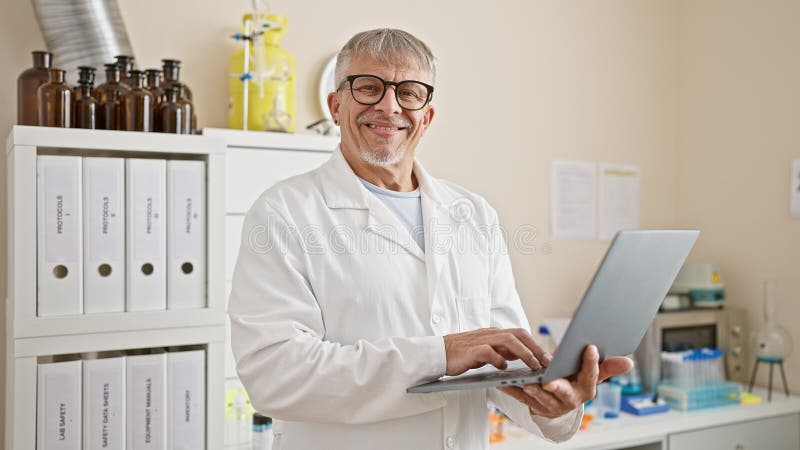 Scientist Using Laptop Modern Laboratory Setting Stock Photos - Free ...