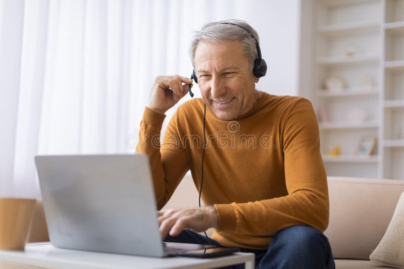 Smiling Senior Man Making a Call with Headset Stock Photo - Image of ...