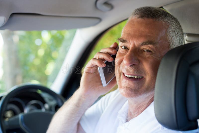 925 Man Looking Phone Smiling Car Stock Photos - Free & Royalty-Free ...