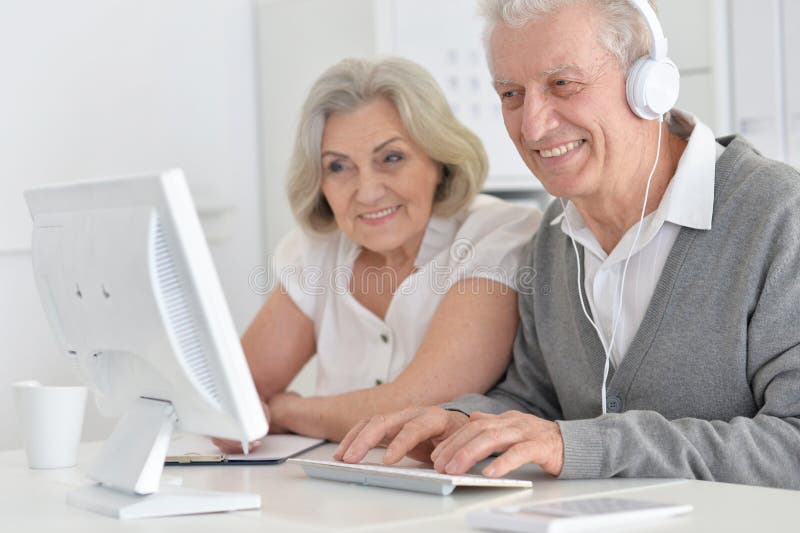 Portrait of Smiling Senior People Working with Computer at Home Stock ...