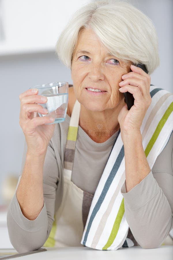 Smiling Senior Woman Making Phone Call at Home Stock Photo - Image of ...
