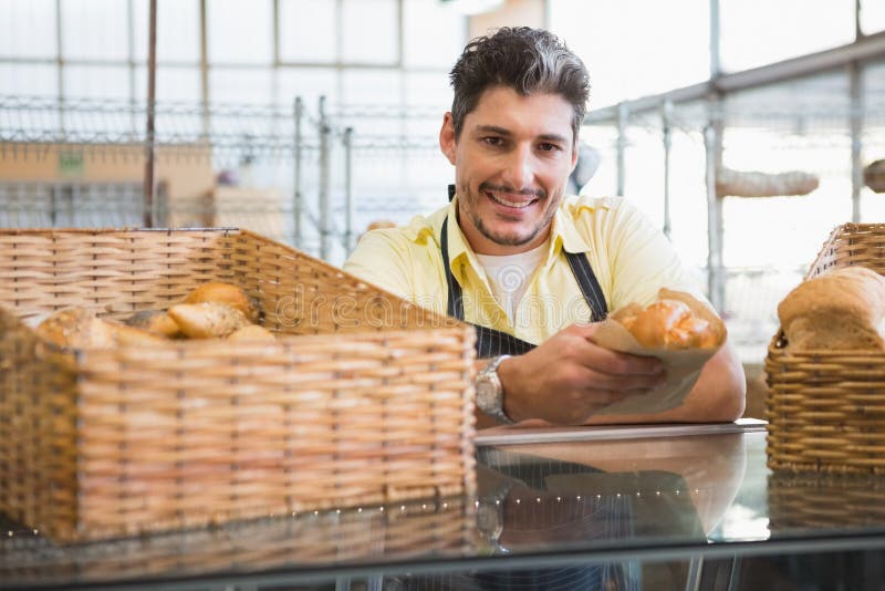 Smiling Server in Apron Holding Bread Stock Image - Image of ...