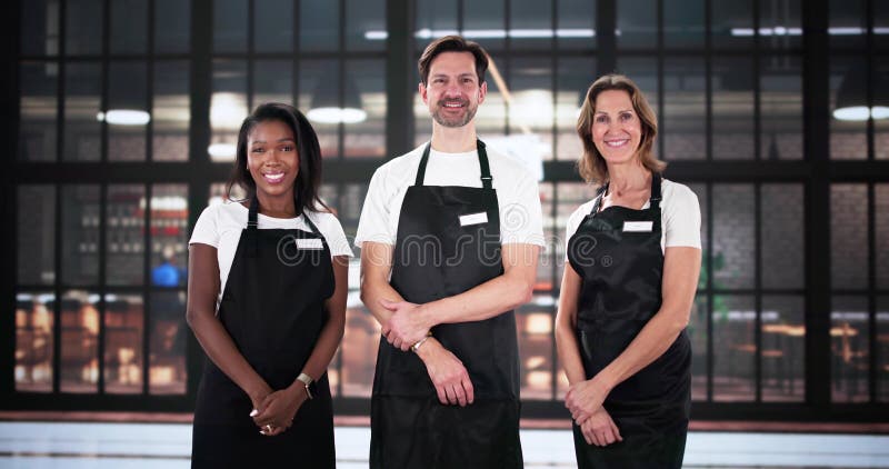Smiling Server and Manager Pose for Restaurant Portrait Stock Photo ...