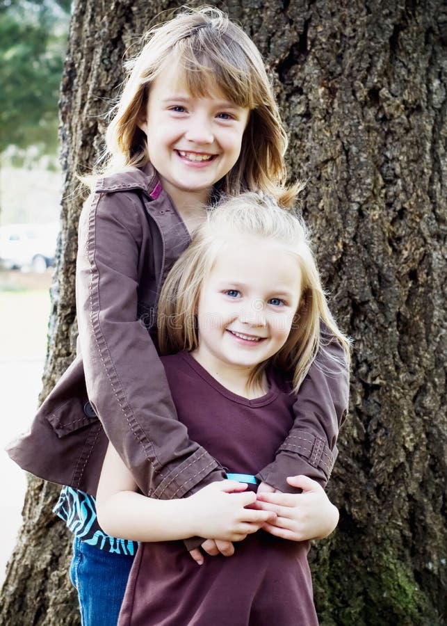 Smiling Sisters stock image. Image of family, hugs, woman - 5235389