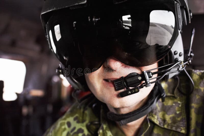 Smiling in the Sky. a Helicopter Pilot Wearing a Helmet and Smiling at ...