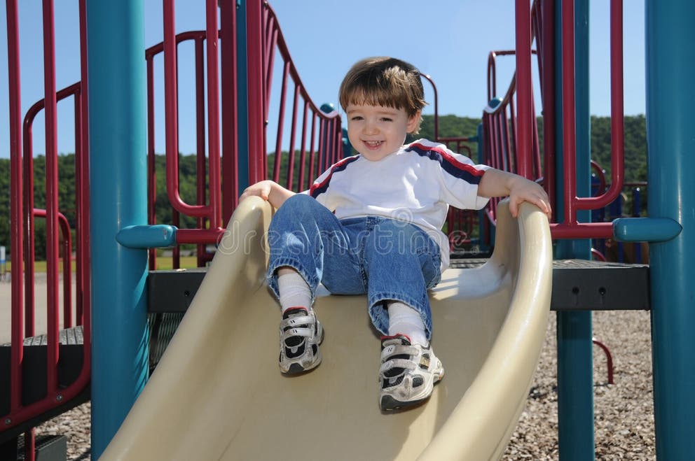 Smiling and sliding stock photo. Image of excitement, little - 6545666