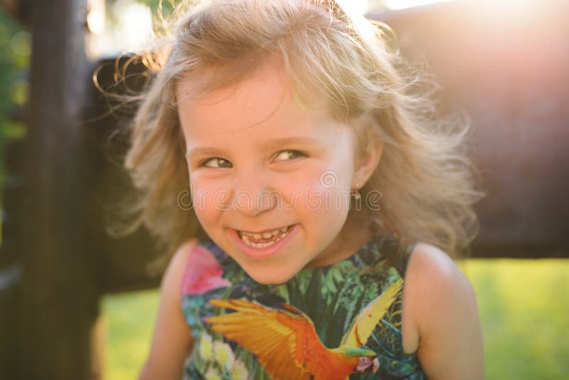 Smiling Sly Girl stock photo. Image of innocence, grass - 84850286