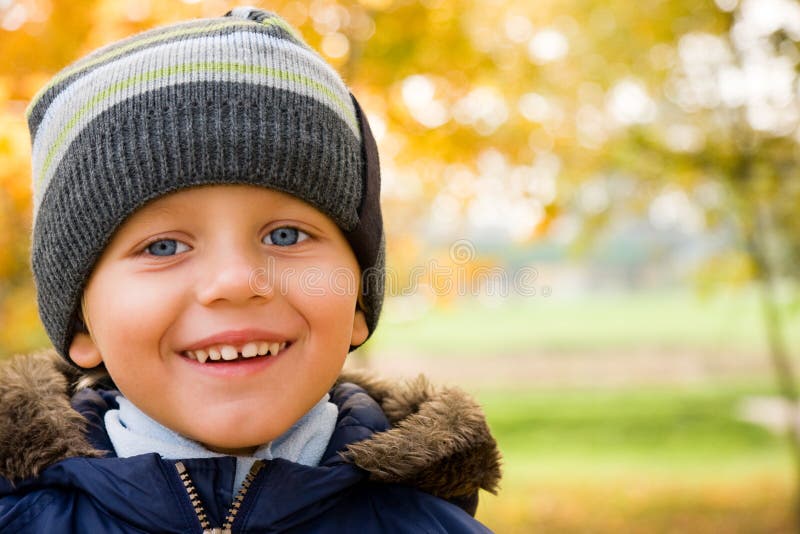 Smiling Small Boy in Autumn Stock Photo - Image of face, park: 11256814