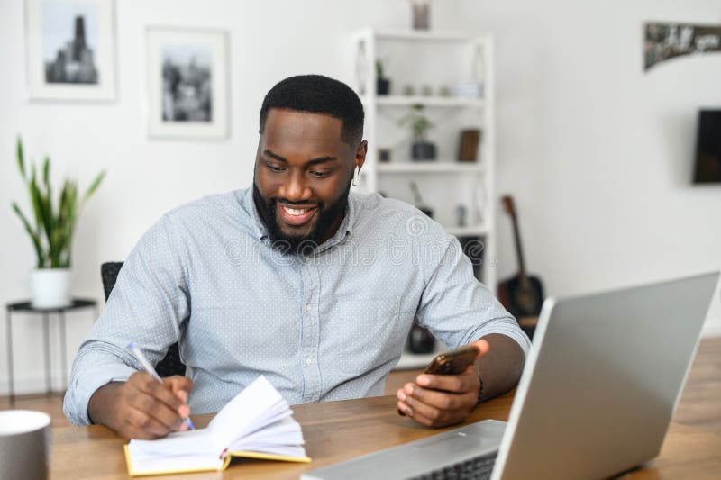 Smiling Smart African American Freelancer Making Notes Stock Image ... Smiling Smart African American Freelancer Making Notes Stock Image ...