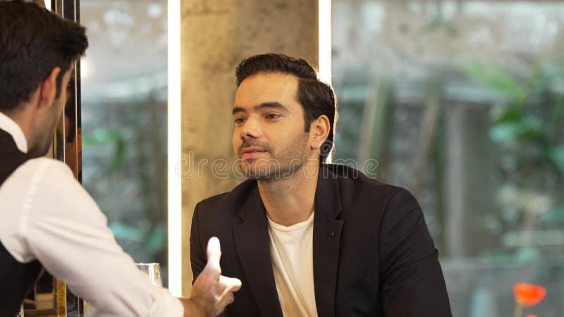 Smiling Smart Customer Sitting at Counter Bar Talking with Bartender ...