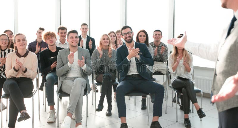 Smiling Speaker Standing in Front of an Applauding Audience Stock Photo ...