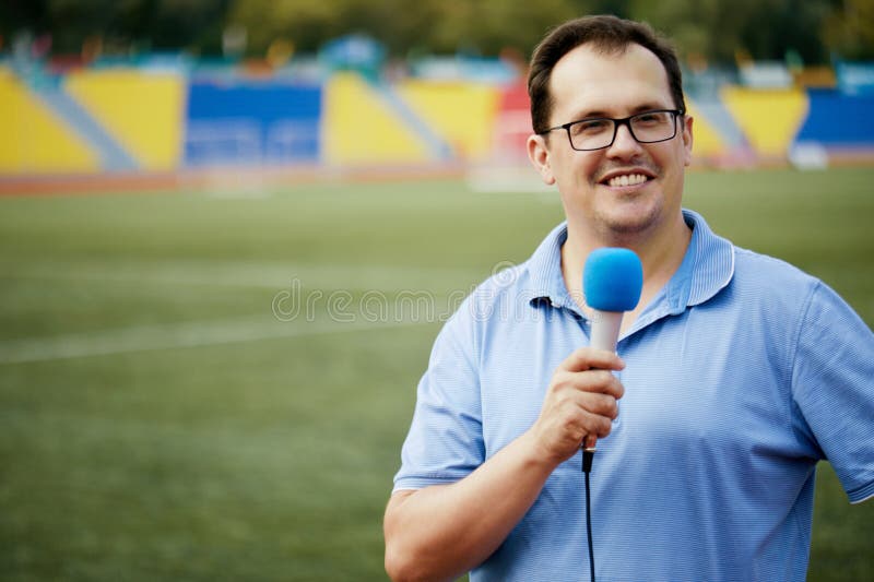 Smiling Sportscaster with Microphone is Reporting Stock Image - Image ...
