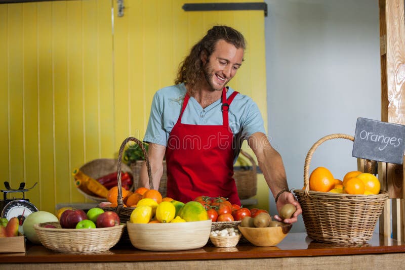 Smiling Staff Standing at Counter Stock Image - Image of apron, apple ...