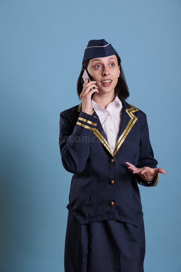 Smiling Stewardess Having Remote Call Using Mobile Phone Stock Image ...