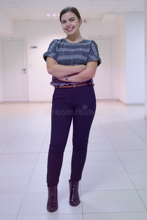 Smiling Student Girl Standing in Hall and Looking at Camera. University ...
