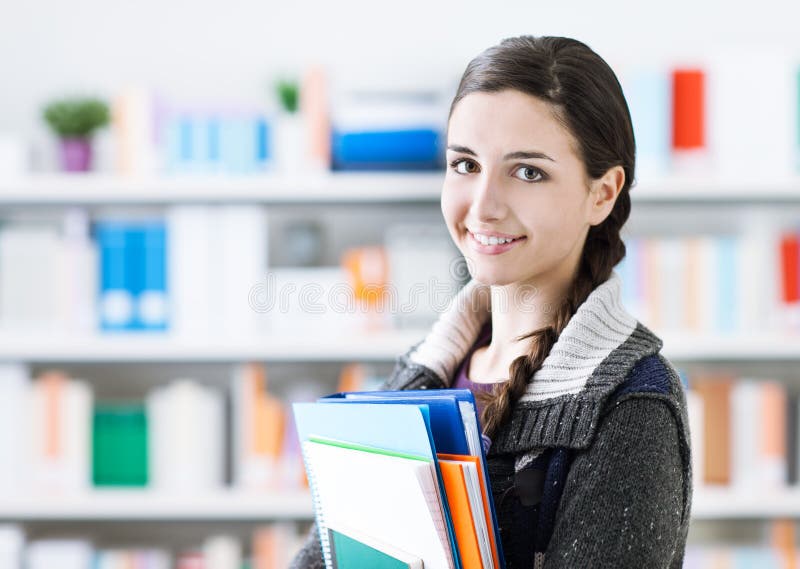 Smiling Student Holding Notebooks Stock Image - Image of beautiful ...