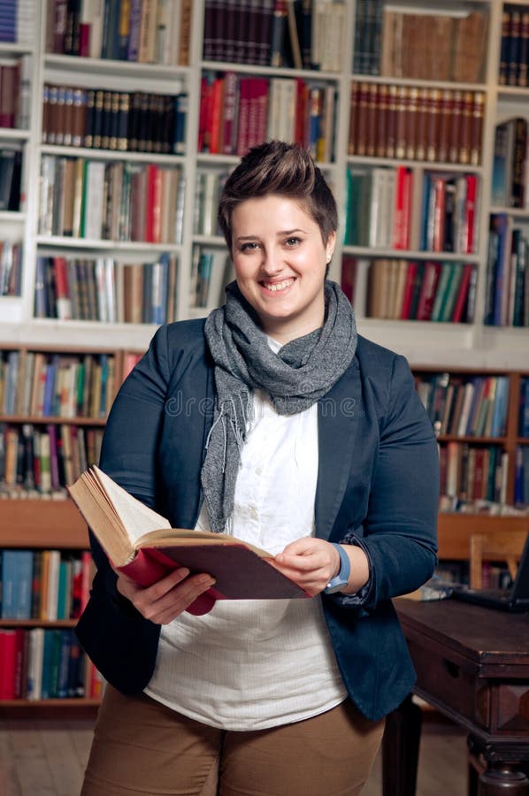 Smiling Student or Librarian Stock Photo - Image of holding, academic ...