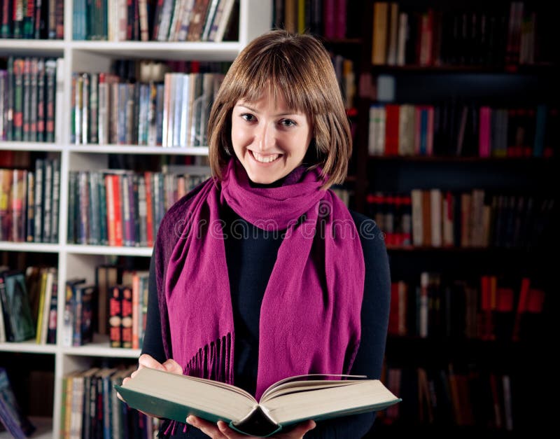Smiling student in library stock photo. Image of holding - 27663458