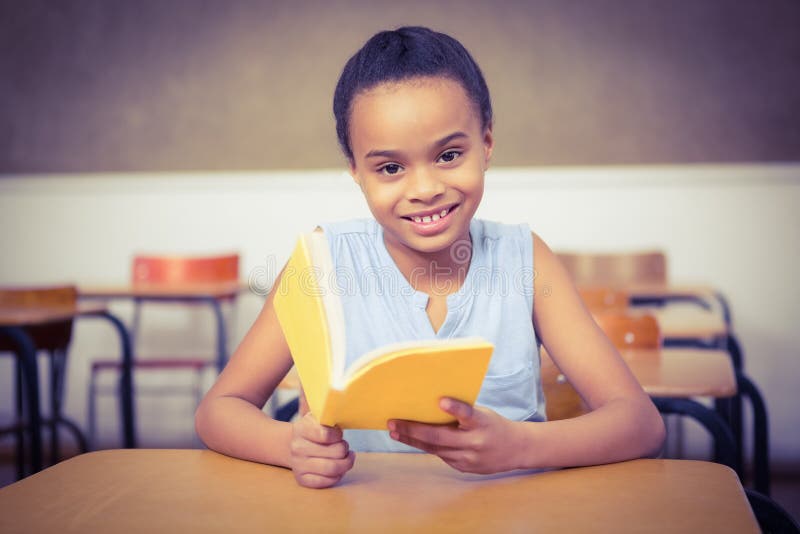 Smiling Student Reading a Book Stock Image - Image of academic ...