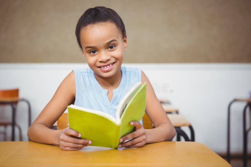 Smiling Student Reading a Book Stock Image - Image of child, early ...