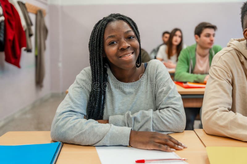 Smiling Student is Sitting at Desk in Classroom during Lesson Stock ...