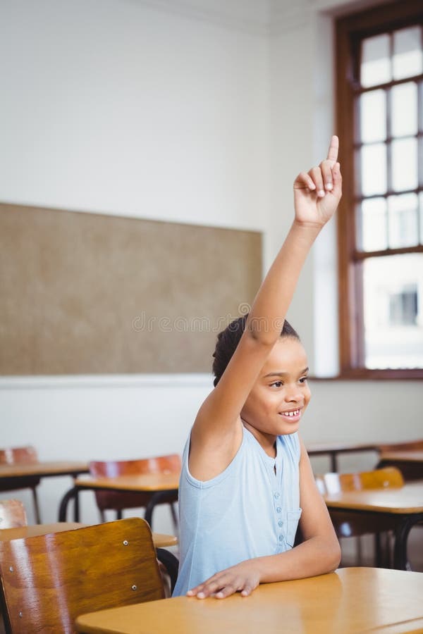 Smiling Student Sitting at a Desk with Raised Arm Stock Image - Image ...