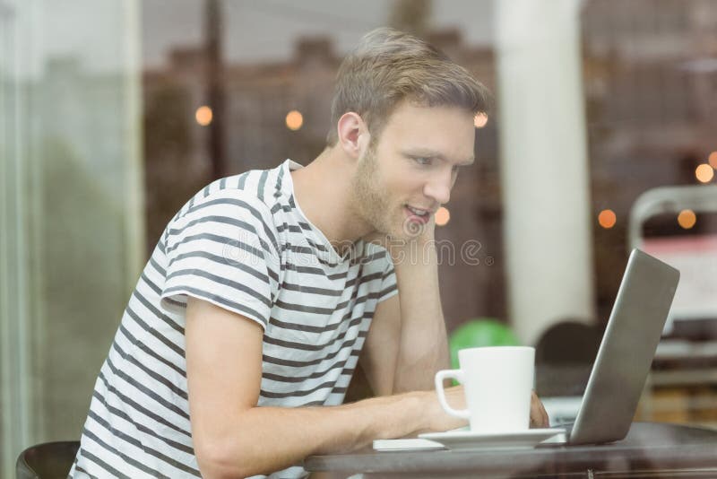 Smiling Student Using Laptop in Cafe Stock Photo - Image of sitting ...