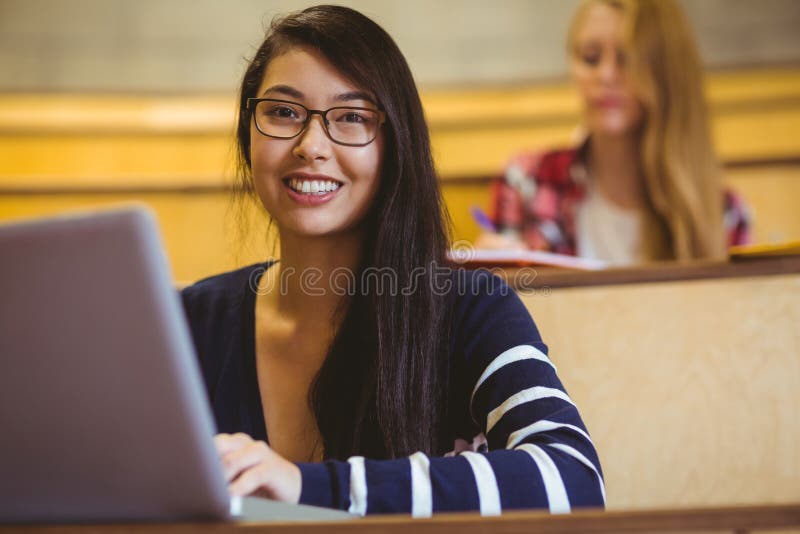 Smiling Student Using Laptop during Class Stock Photo - Image of higher ...
