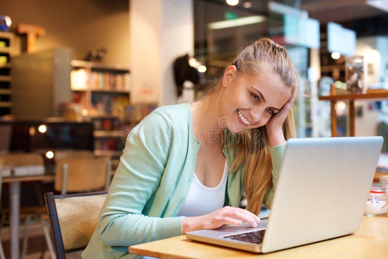 Smiling Student Using Laptop Stock Image - Image of indoor, background ...