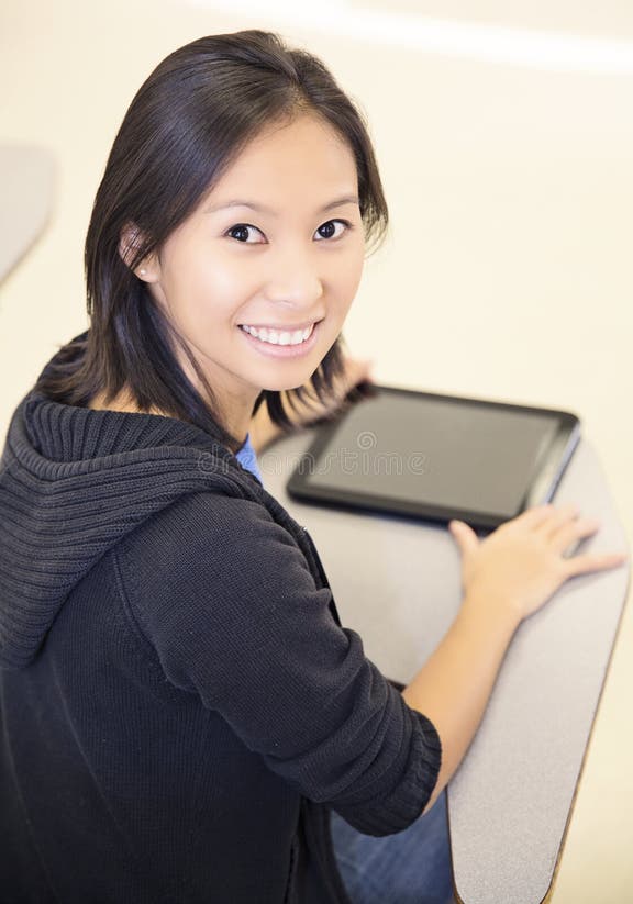 Smiling Student Using a Tablet Computer Stock Image - Image of asian ...