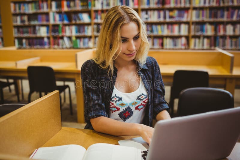 Smiling Student Working while Using Her Laptop Stock Photo - Image of ...