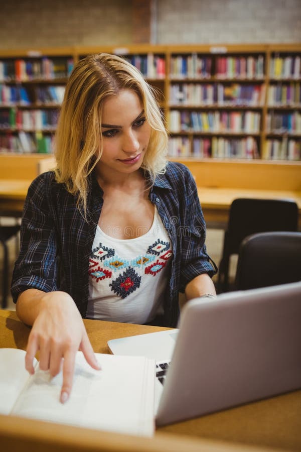 Smiling Student Working while Using Her Laptop Stock Image - Image of ...