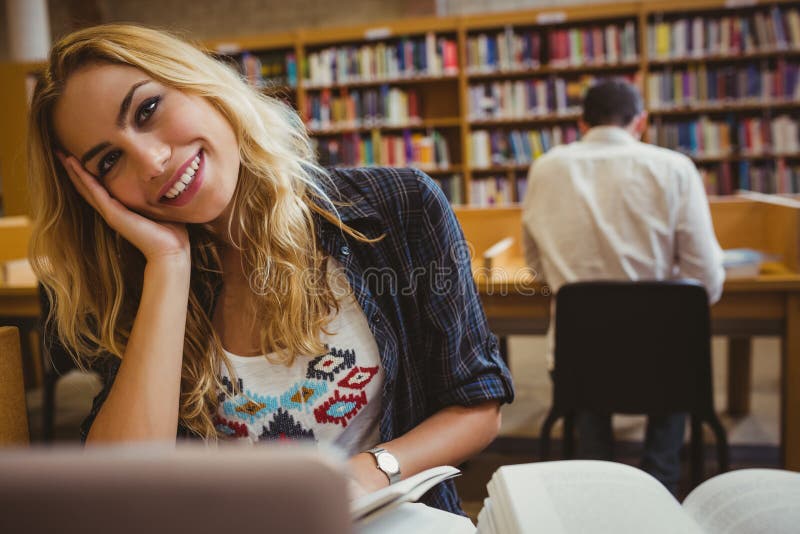 Smiling Student Working while Using Her Laptop Stock Photo - Image of ...