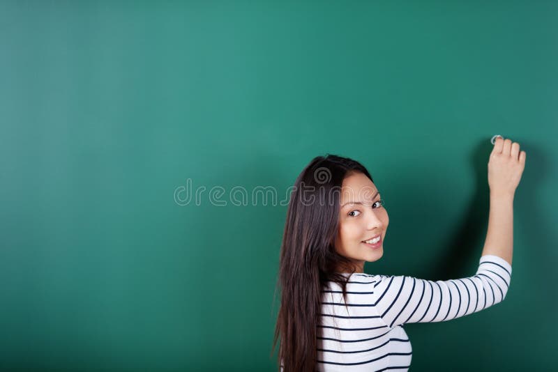 Smiling Student Writing on Empty Blackboard Stock Photo - Image of ...