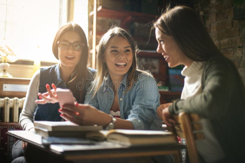 Smiling Students Girls Having Conversation and Using Smart Stock Photo ...