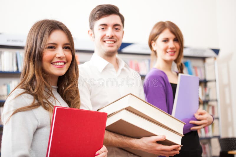 Smiling Students in a Library Stock Photo - Image of campus, college ...