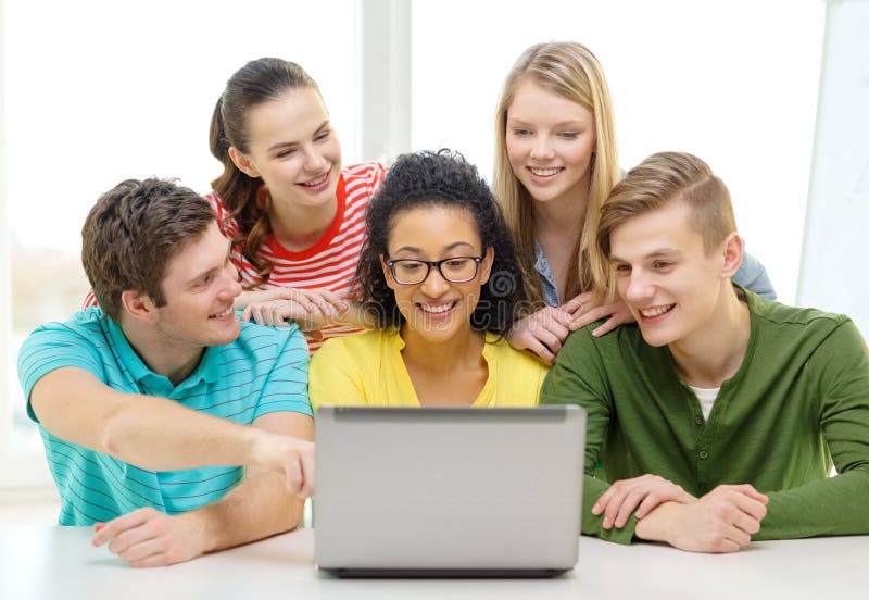 Smiling Students Looking at Laptop at School Stock Image - Image of ...