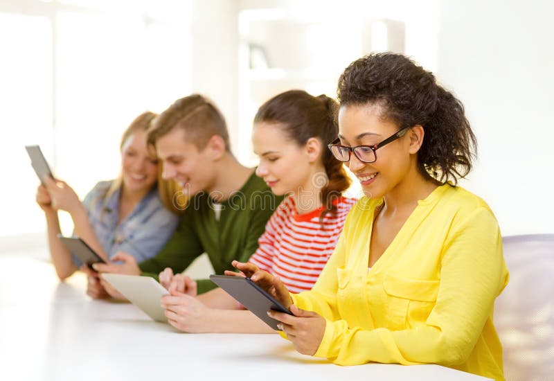 Smiling Students Looking at Tablet Pc at School Stock Image - Image of ...