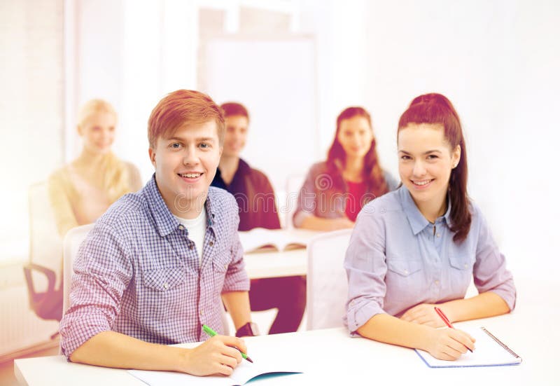 Smiling Students with Notebooks at School Stock Photo - Image of group ...